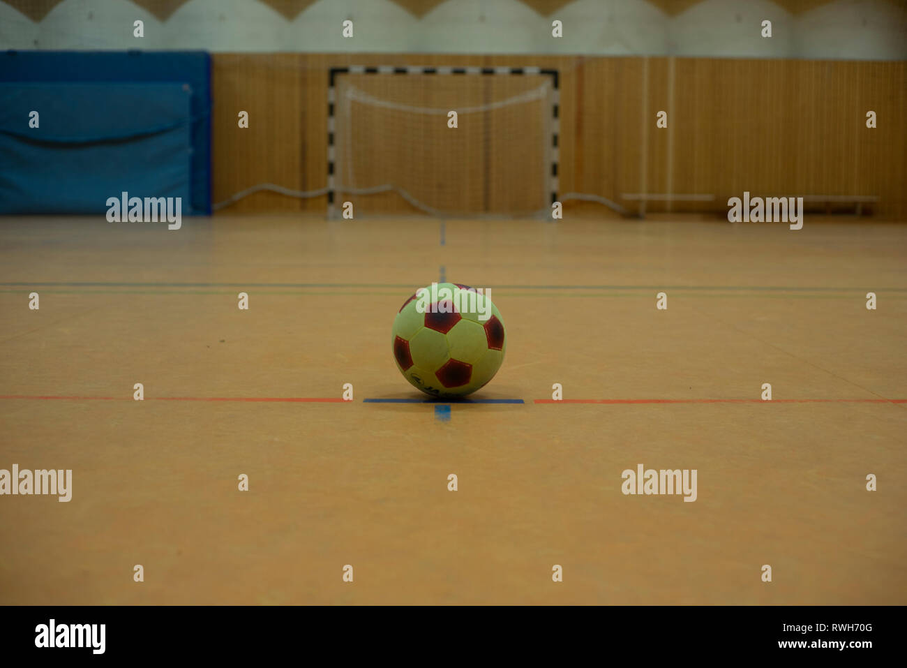 Soccer ball in a modern gym Stock Photo - Alamy