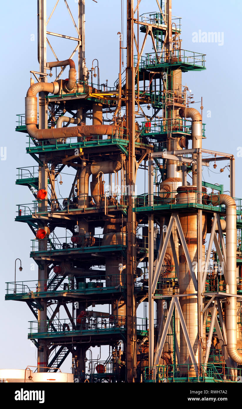 Tubes, pipes and scaffold from an oil refinery - late evening light ...