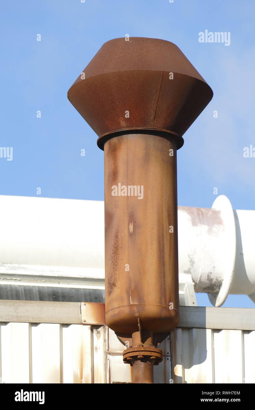 Roof, old rusty chimney pipe made of metal Stock Photo - Alamy