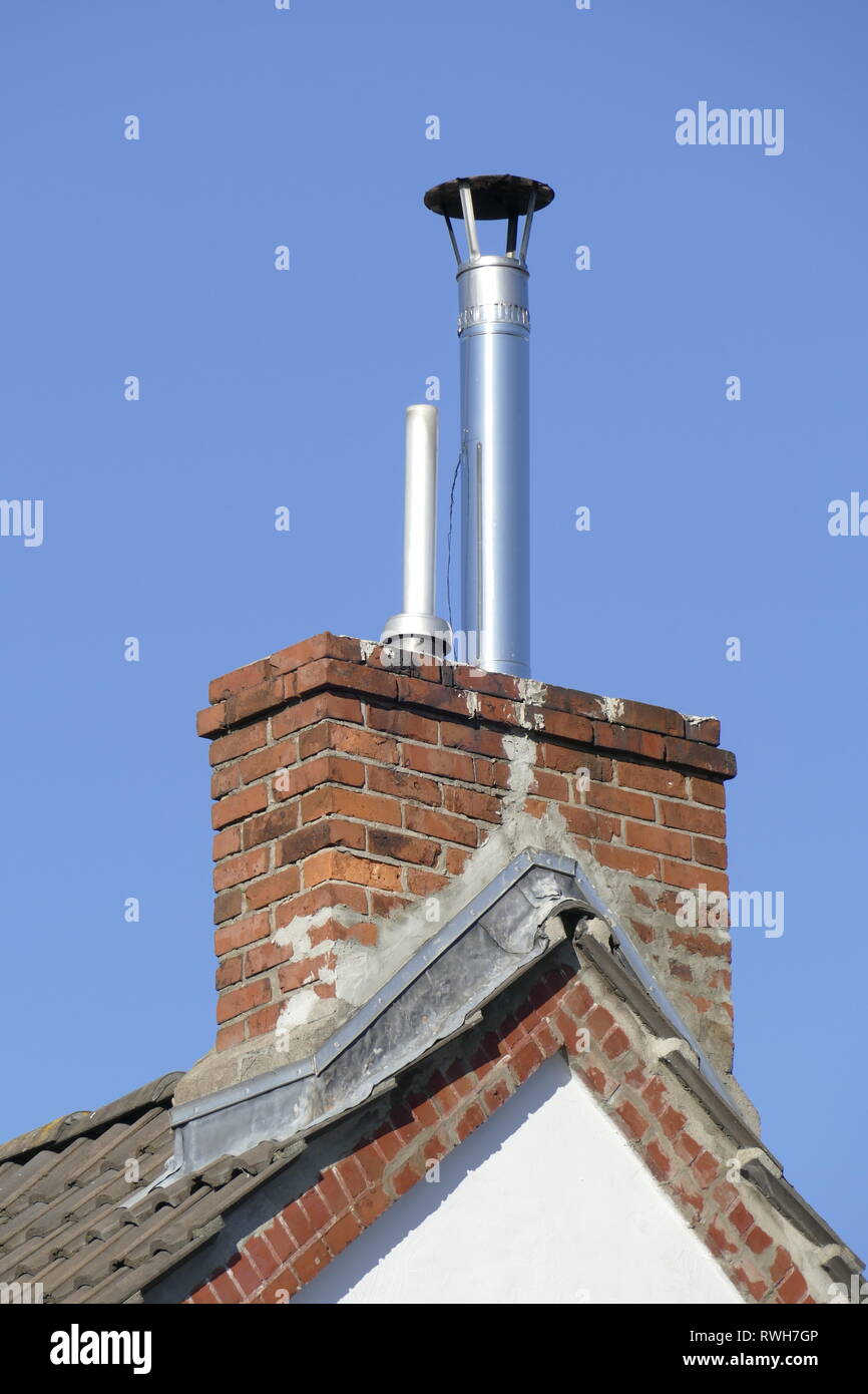 Roof, chimney, chimney pipes of metal Stock Photo - Alamy