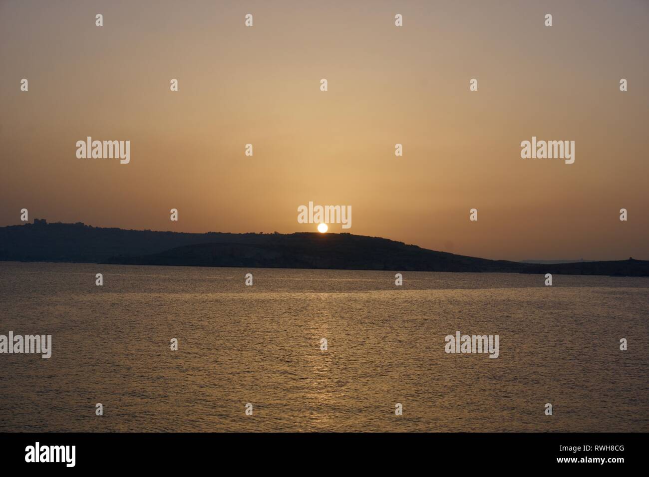 Beach time, sunset in Malta, Malta Island Stock Photo - Alamy