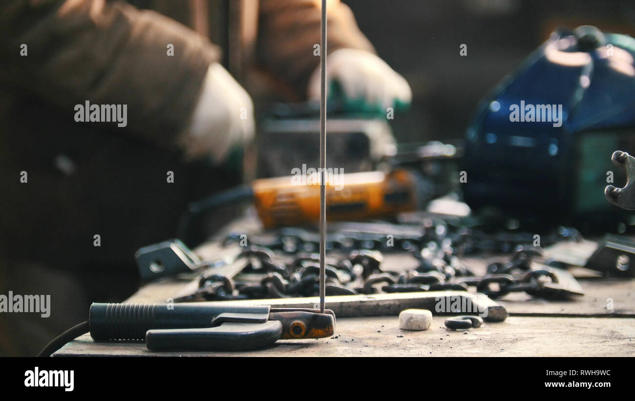 Industrial. Construction site. The man worker grinding. Tools and ...