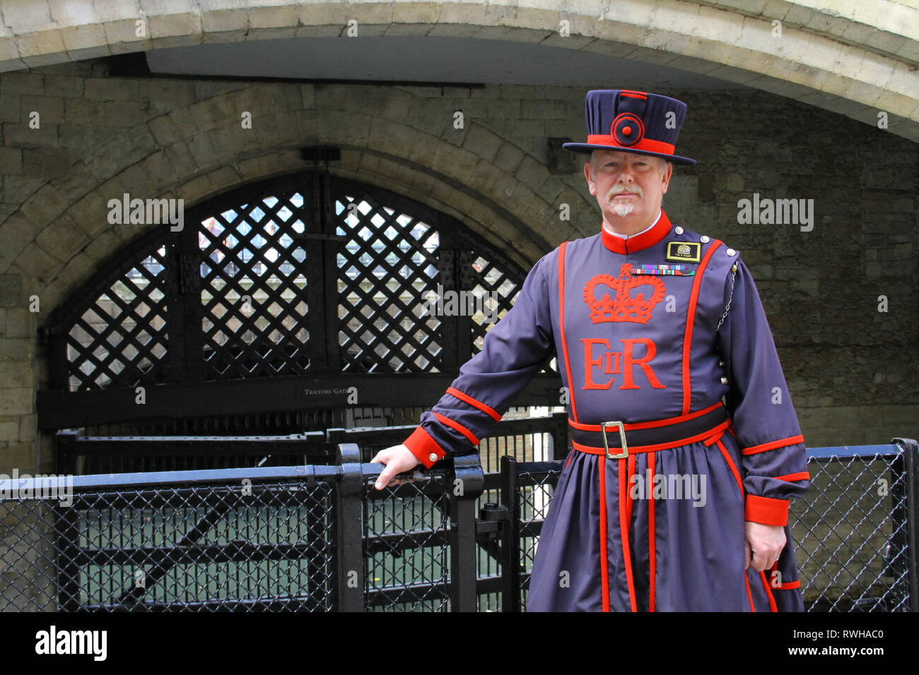 A Yeoman Warder or Beefeater in front of Traitors Gate at the Tower of ...