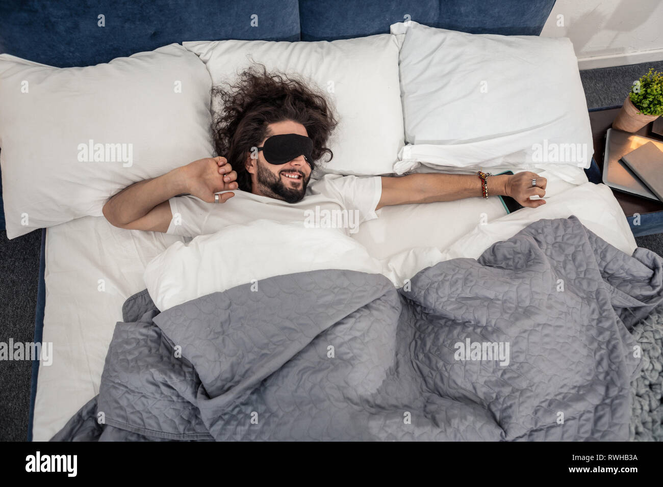 Man sleeping alone bed smiling hi-res stock photography and images - Alamy