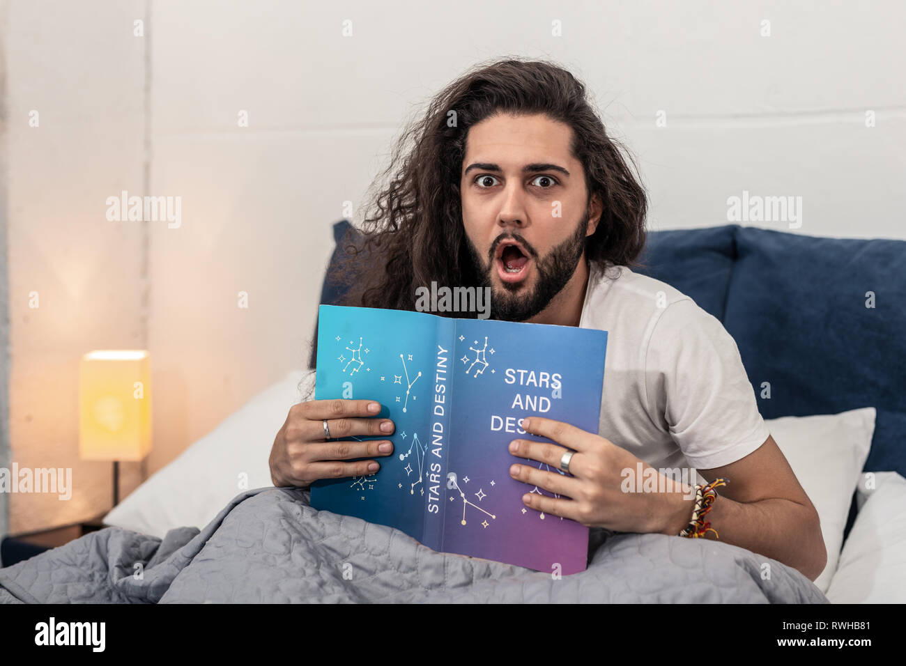 Surprised person reading book hi-res stock photography and images - Alamy