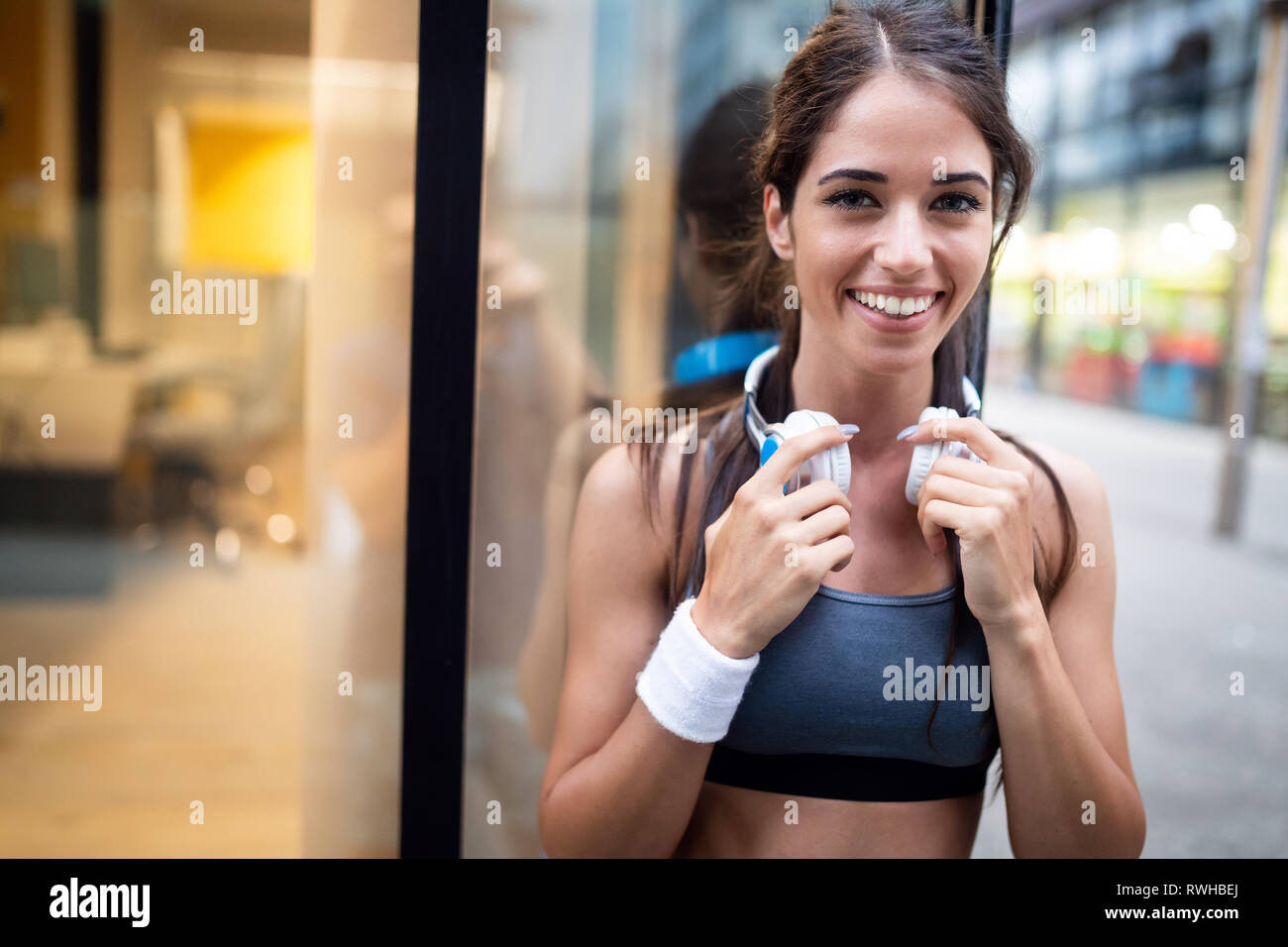 Portrait of happy fit woman in city. Healthy lifestyle concept Stock ...