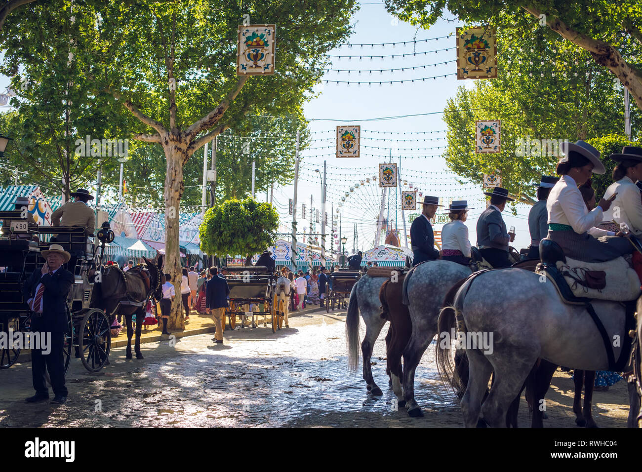 Riders and People dressed in traditional costumes enjoy April Fair ...