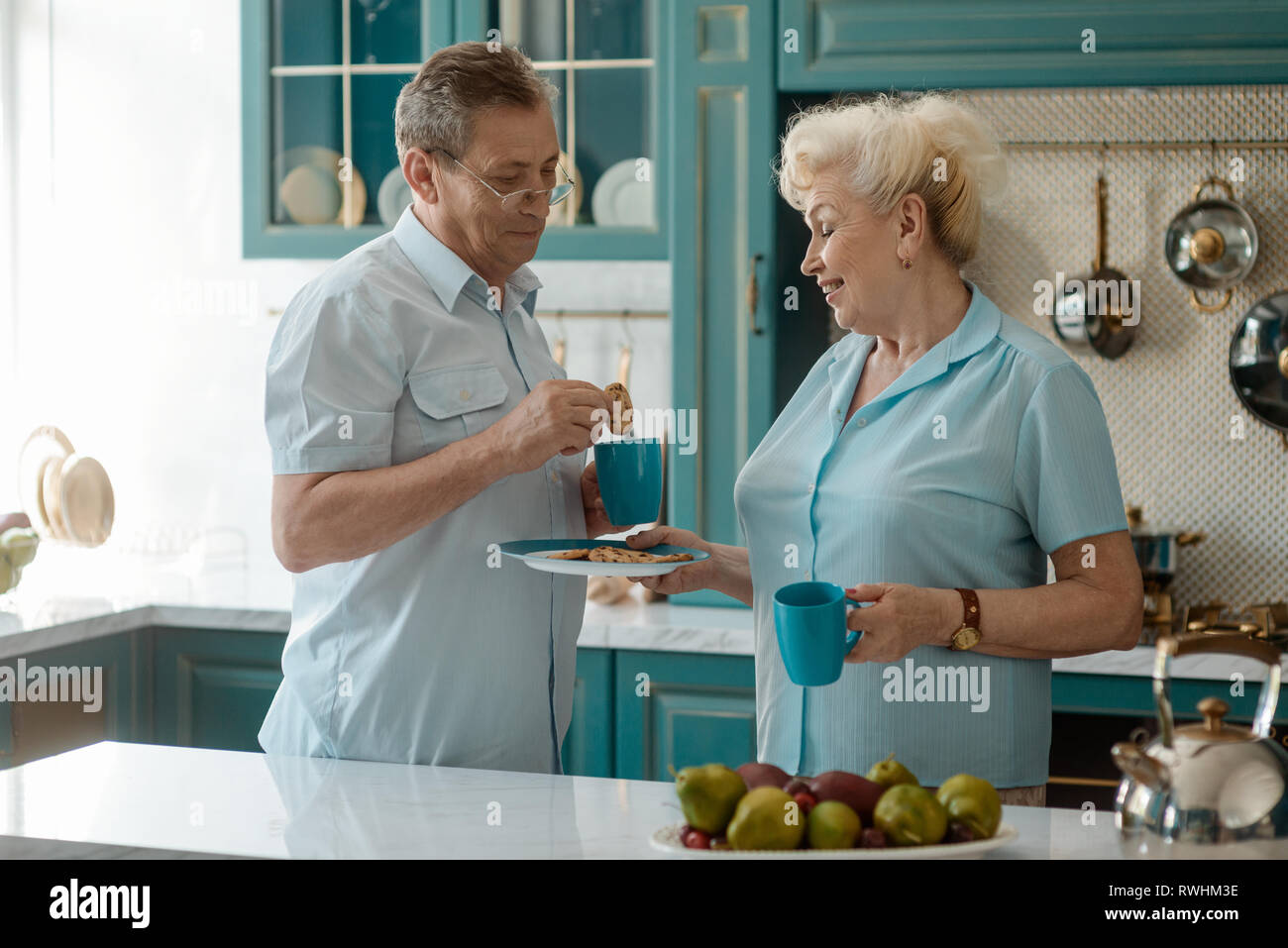 Elderly people having tea time Stock Photo - Alamy