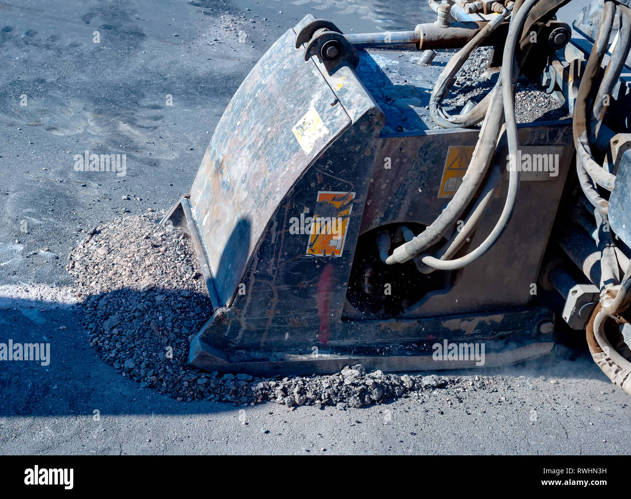 worker driver Skid steer remove Worn Asphalt during repairing Road ...