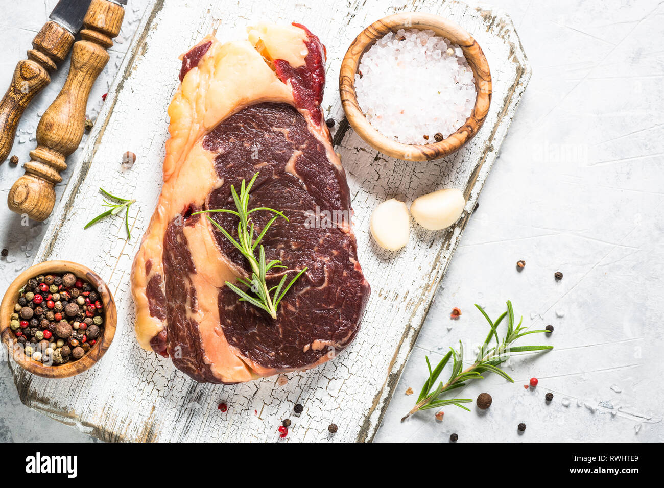 Beef steak ribeye with herbs and spices top view Stock Photo - Alamy