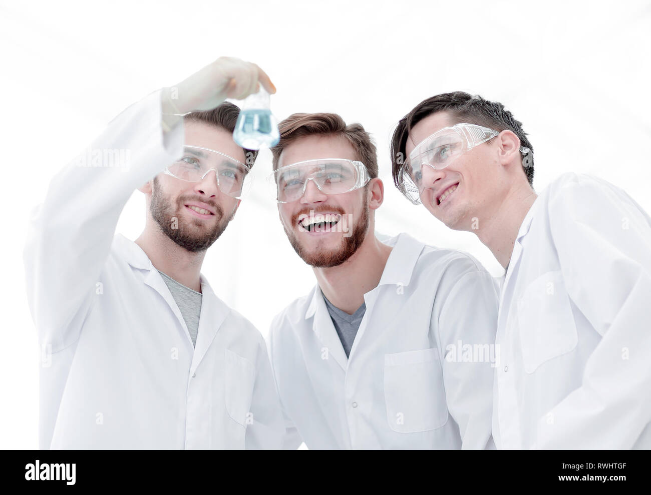happy scientists look at the result of their work Stock Photo - Alamy
