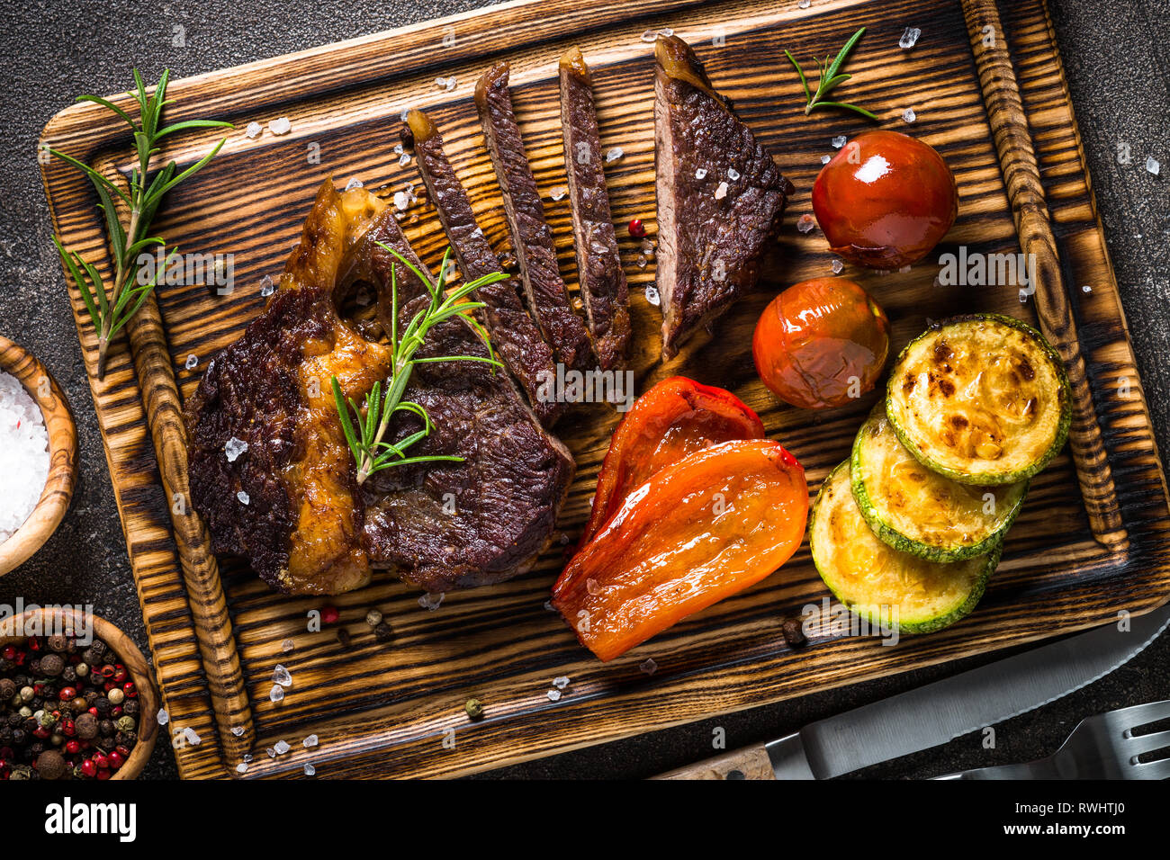 Grilled beef steak with vegetables top view Stock Photo - Alamy