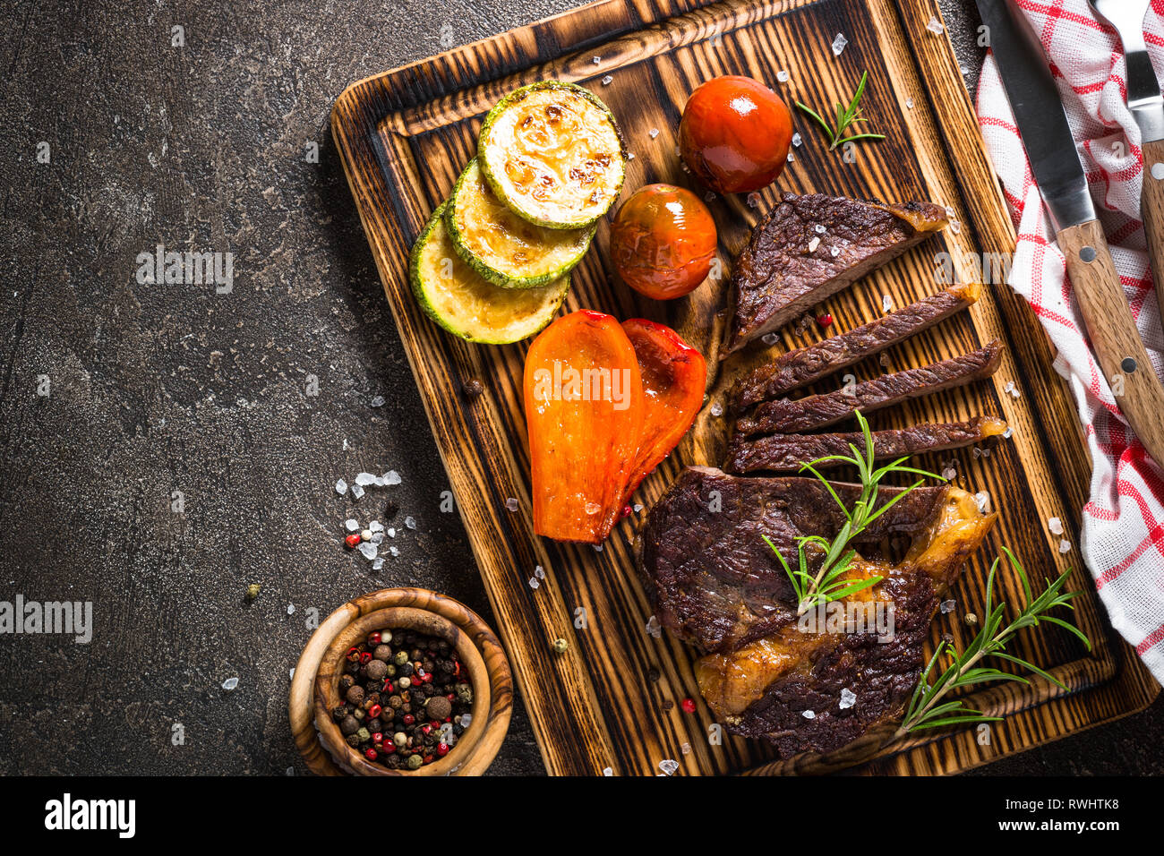 Grilled beef steak with vegetables top view Stock Photo - Alamy