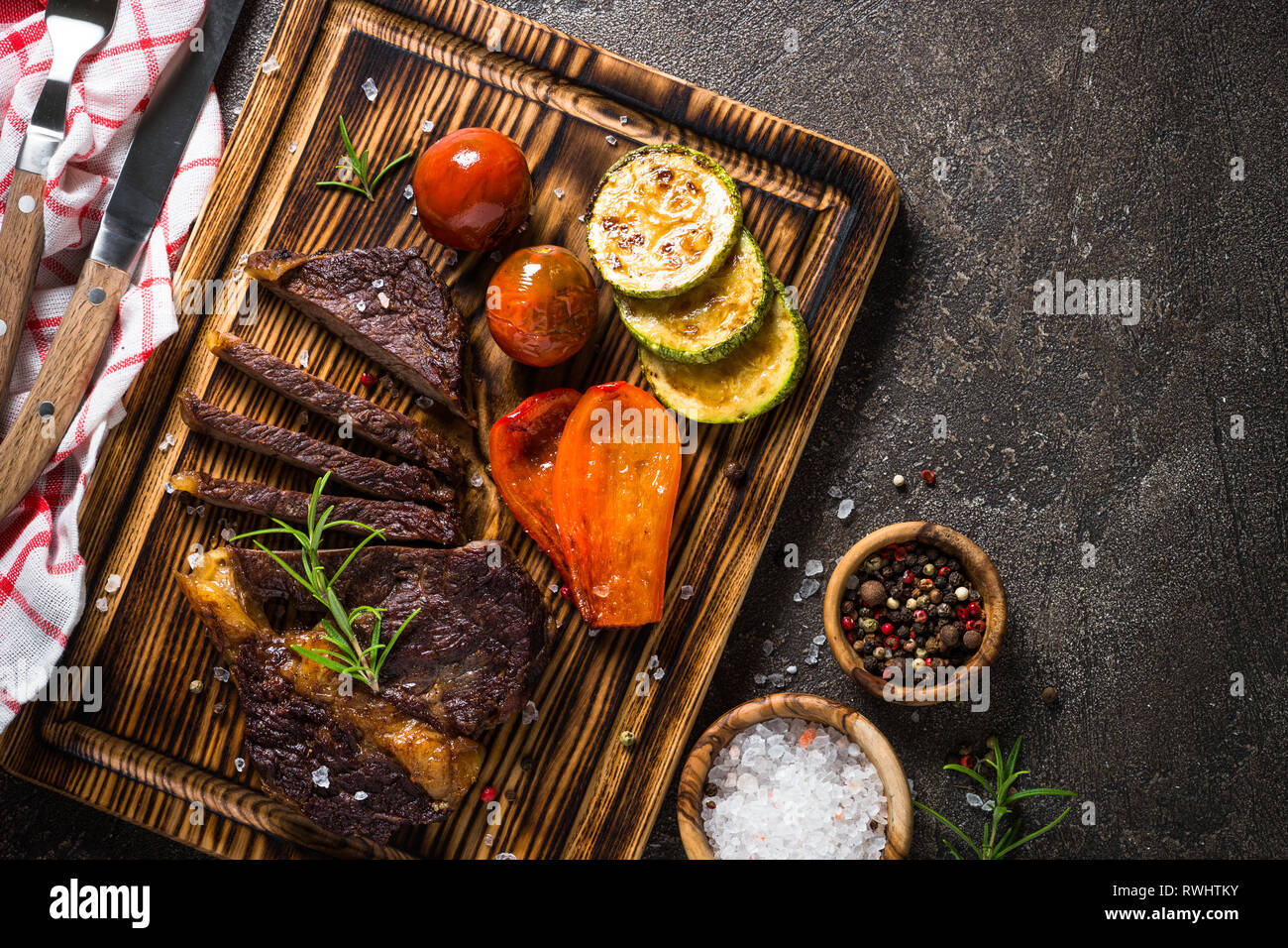 Grilled beef steak with vegetables top view Stock Photo - Alamy
