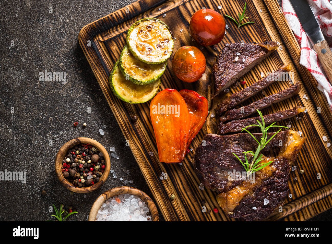 Grilled beef steak with vegetables top view Stock Photo - Alamy