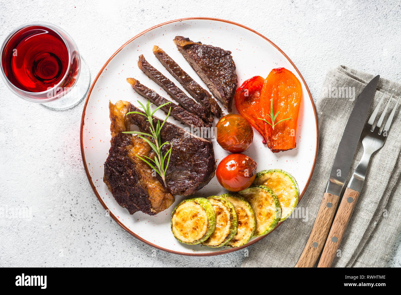 Grilled beef steak with vegetables top view Stock Photo - Alamy