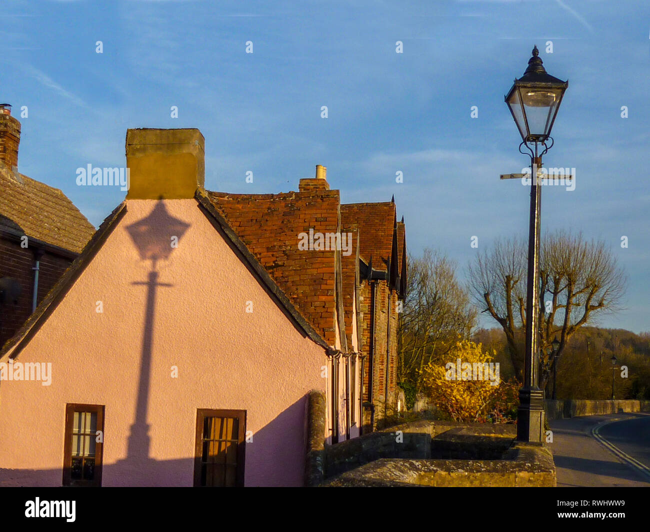 Lamp post shadow on house Stock Photo - Alamy