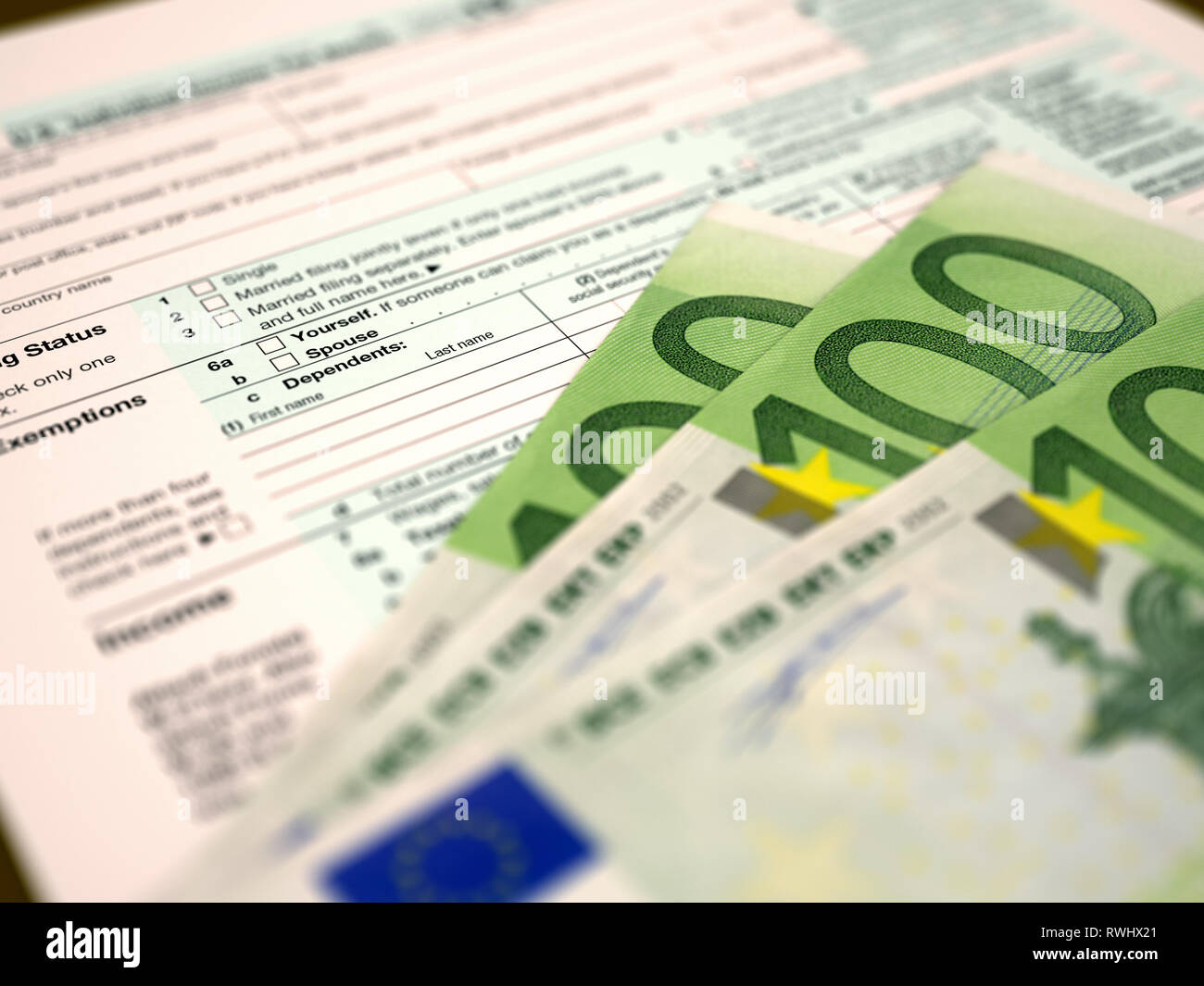 Tax form 1040 and euros Stock Photo - Alamy