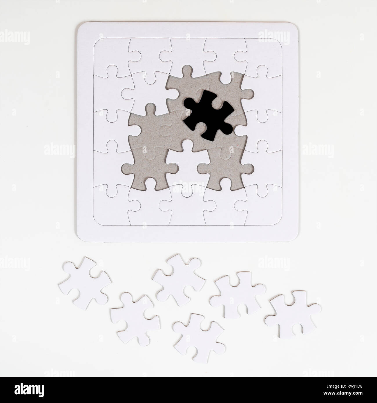 the incomplete puzzle with a black piece Stock Photo - Alamy