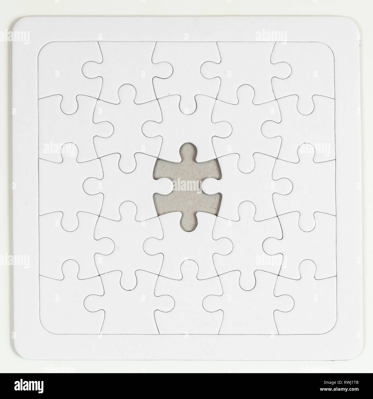 the empty and completely white puzzle with a missing piece Stock Photo ...