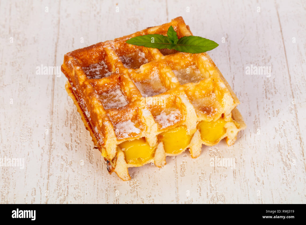 Sweet Waffle with berry jam Stock Photo - Alamy