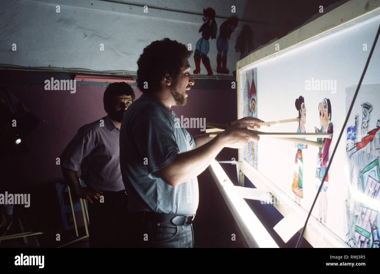 Backstage during a performance of the traditional Greek shadow puppet ...