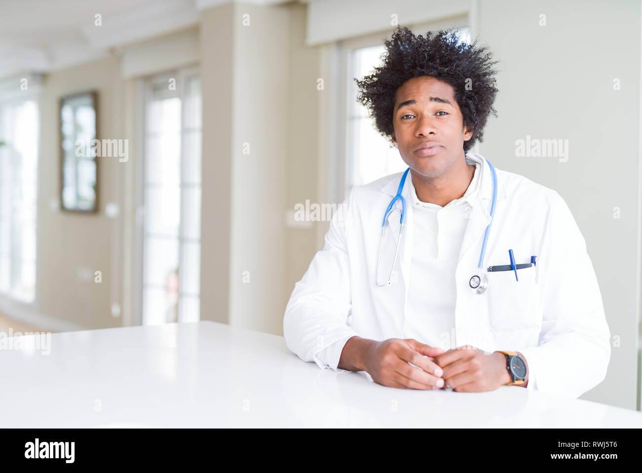 African American doctor man at the clinic depressed and worry for ...