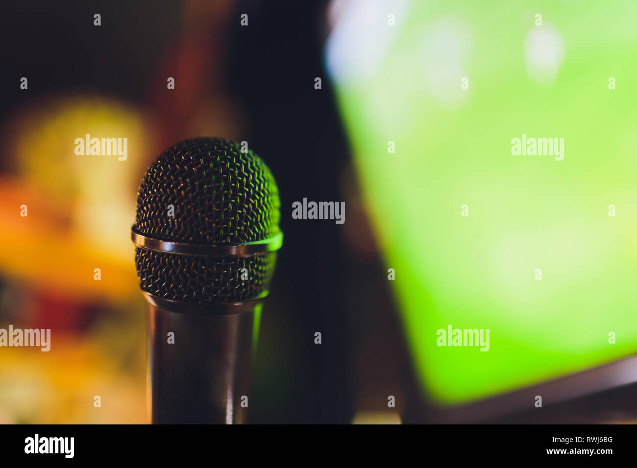 Microphone for commentator with sport football field stadium background ...