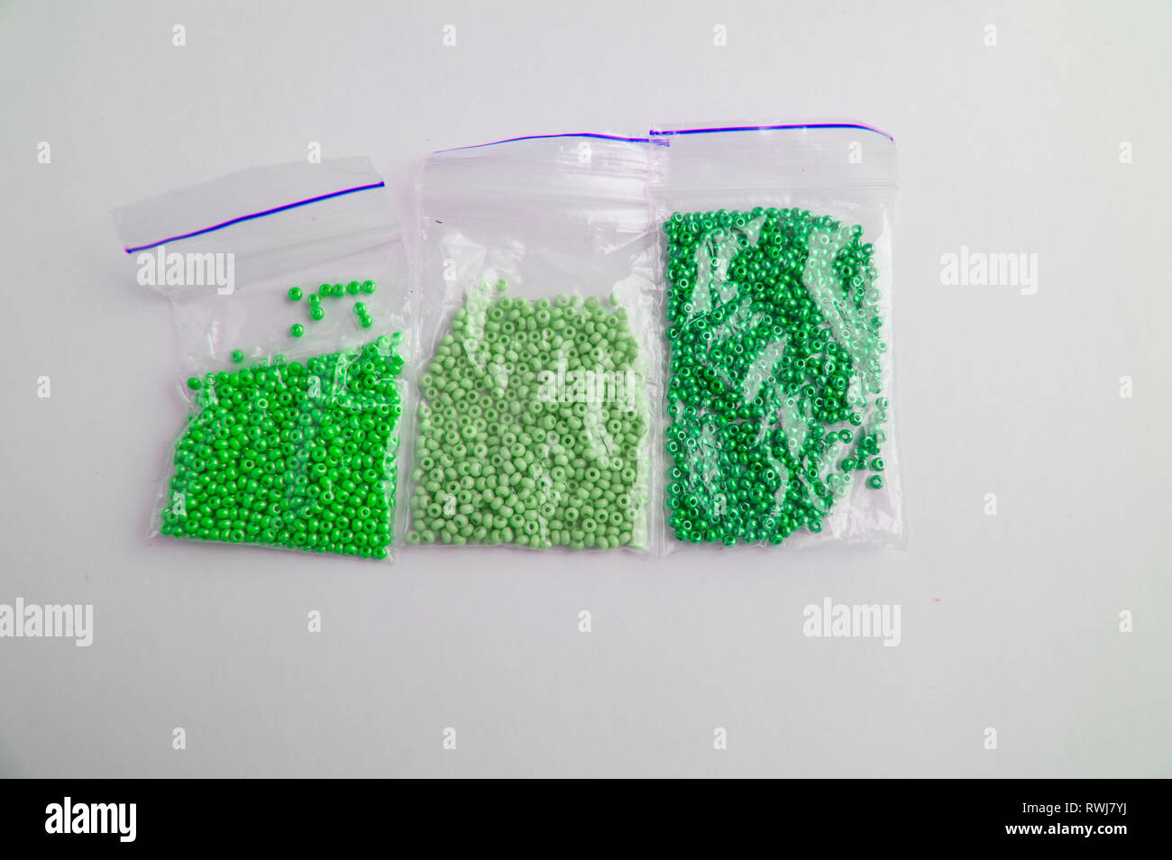 Set of multi-colored beads and beads in a mini plastic bag for ...
