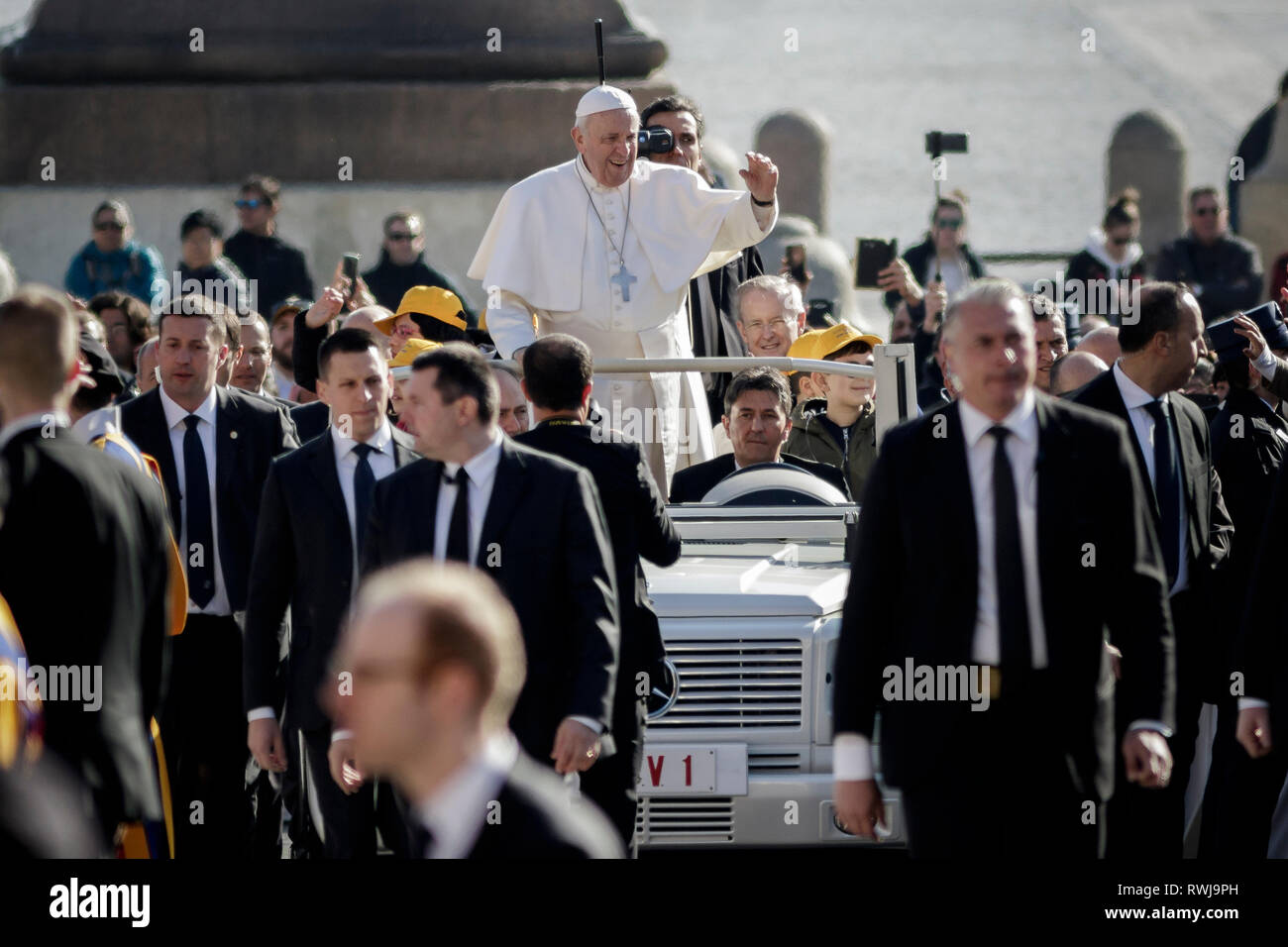 Pope Francis seen riding on the Pope-mobile through the crowd of the ...