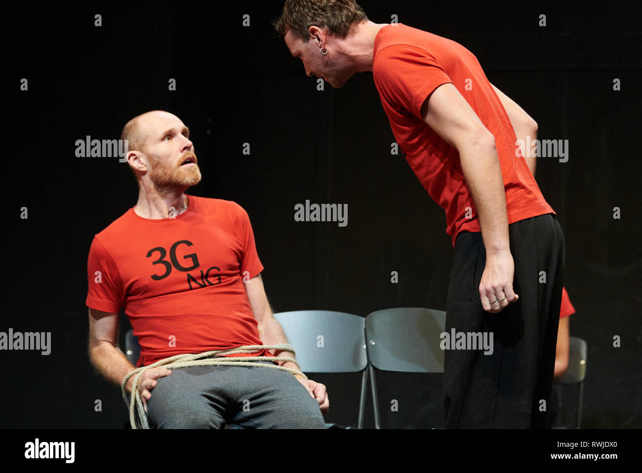 Berlin, Germany. 06th Mar, 2019. On stage Niels Bormann sits tied up on ...