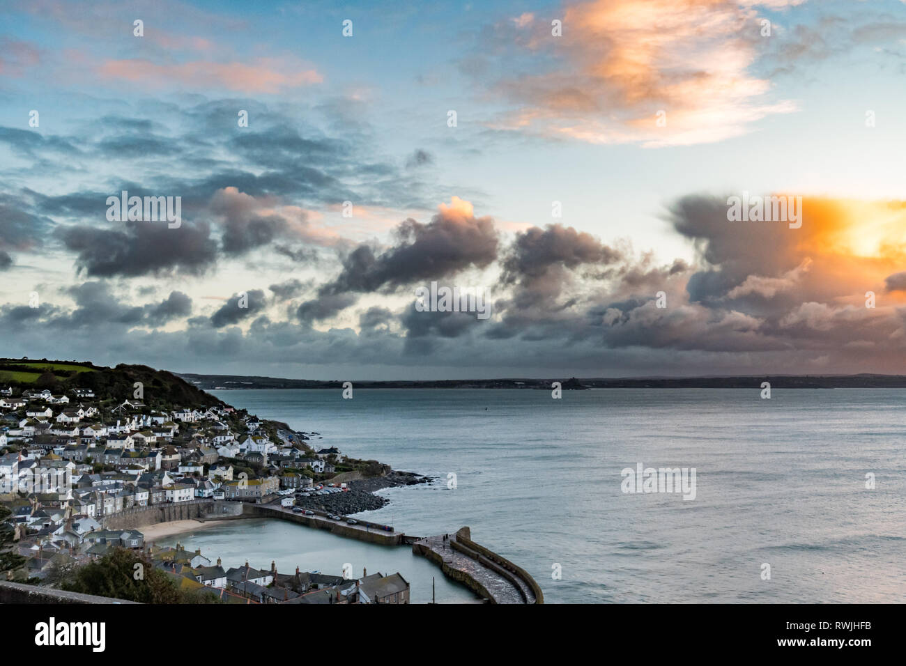 Mousehole village and harbour from high up showing sea and sky Stock ...