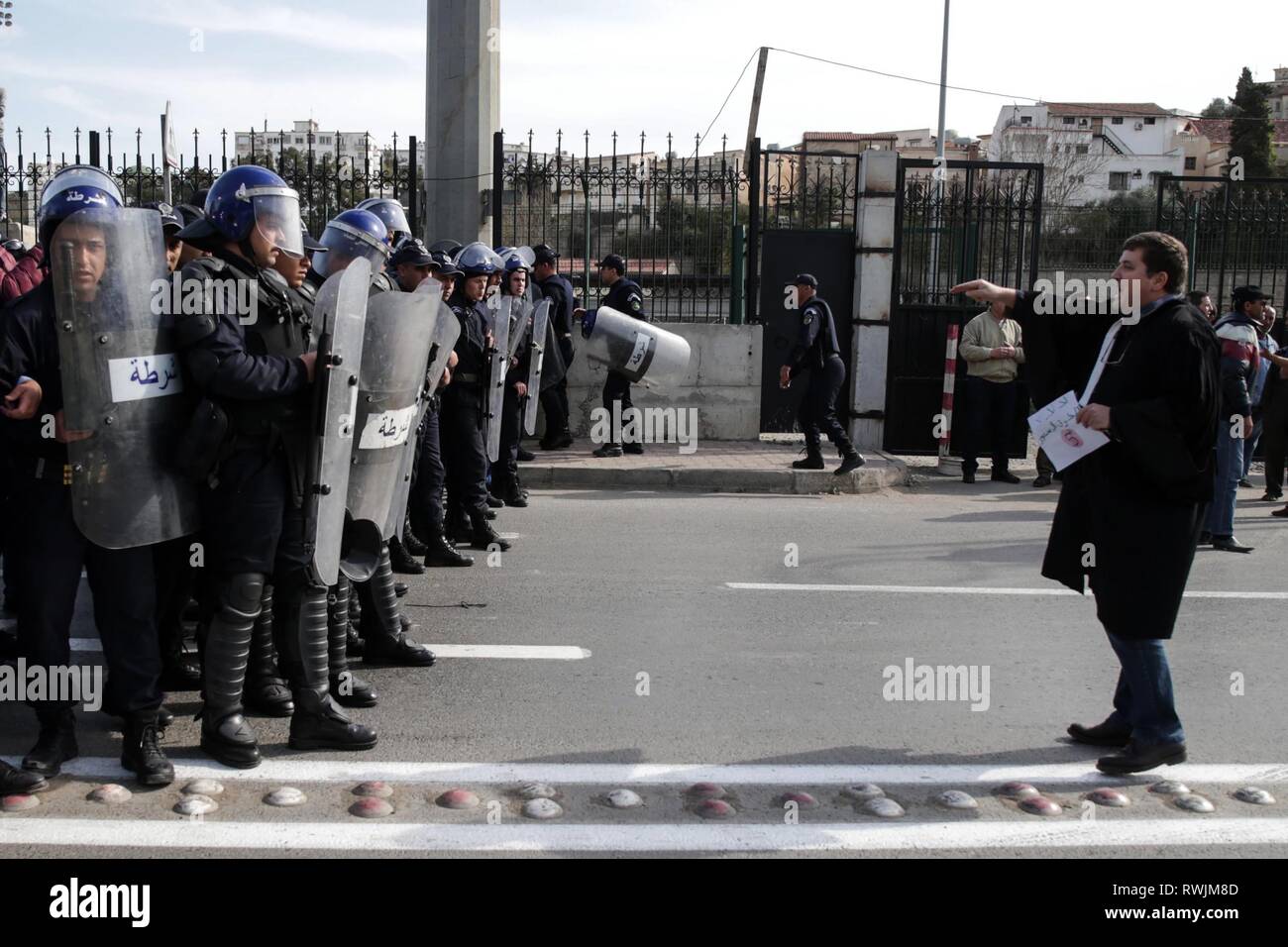 Algiers, Algeria. 07th Mar, 2019. Riot police face protesters during a ...
