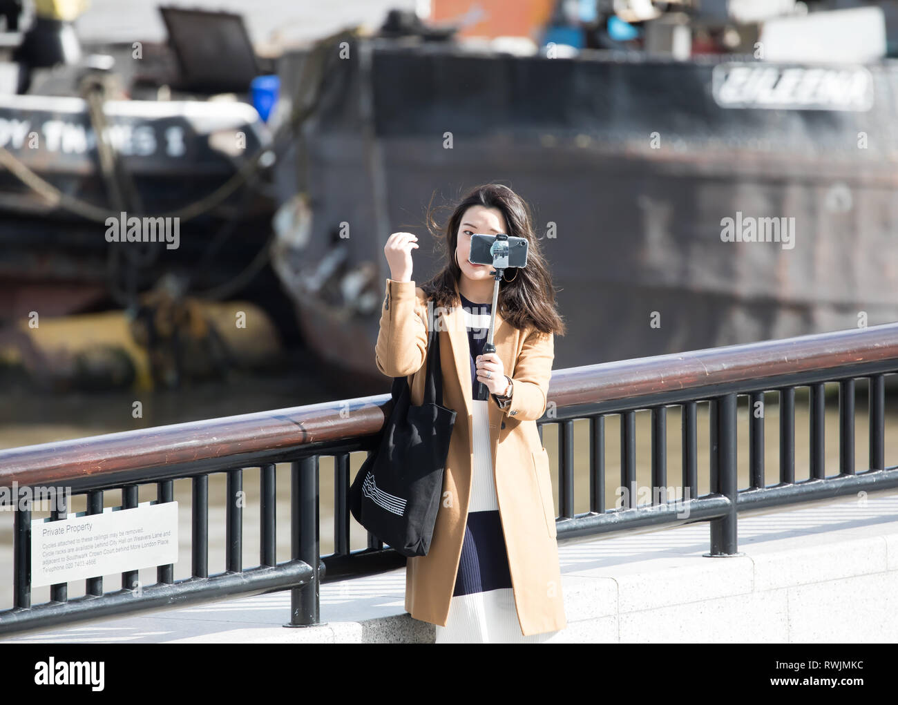London, UK. 7th Mar, 2019. A lady takes a selfie in Queenswalk London ...