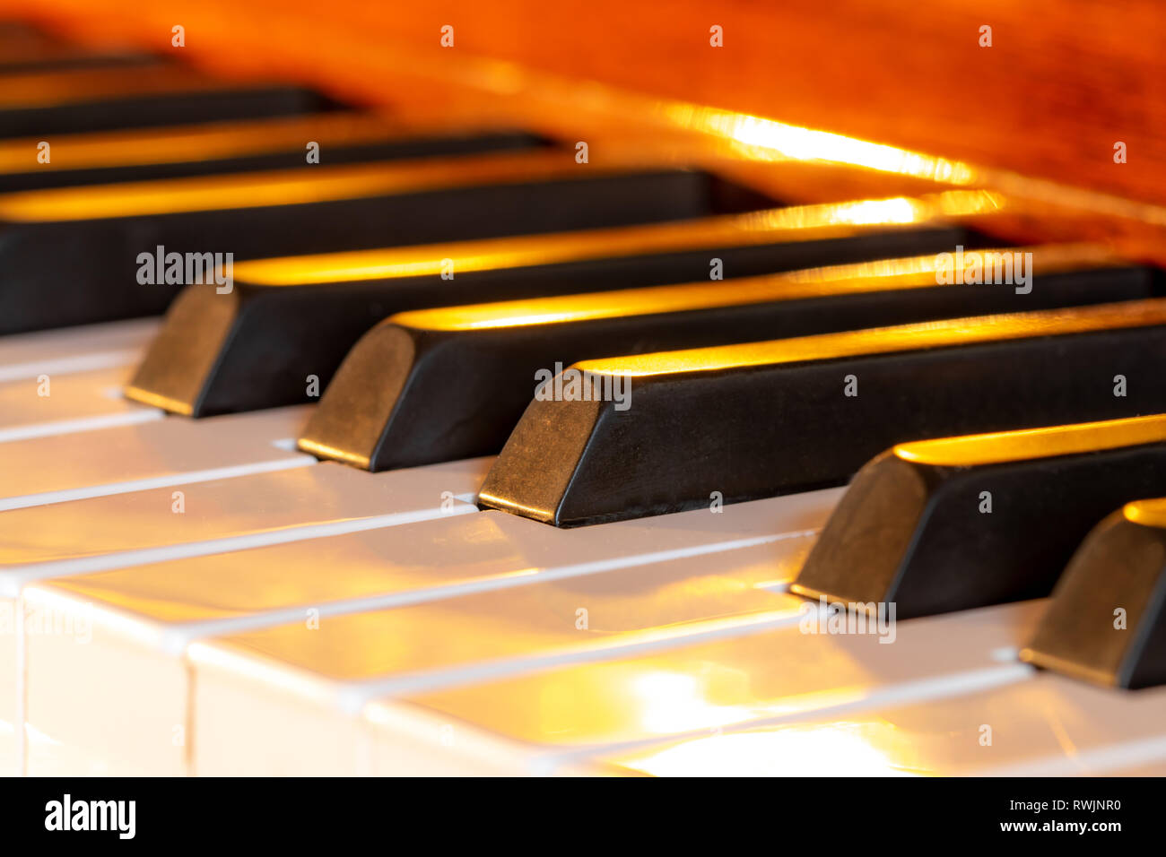 piano keys classic much concert closeup in golden candlelight, sound ...