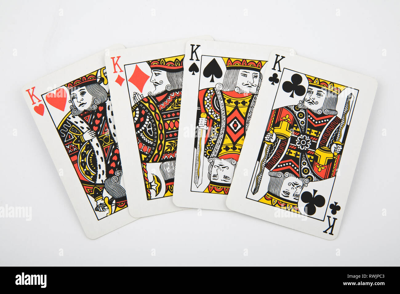 four kings - playing card on light background Stock Photo - Alamy