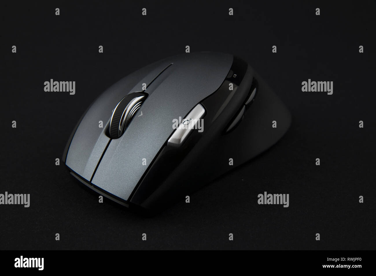 cordless computer mouse on very dark background Stock Photo - Alamy