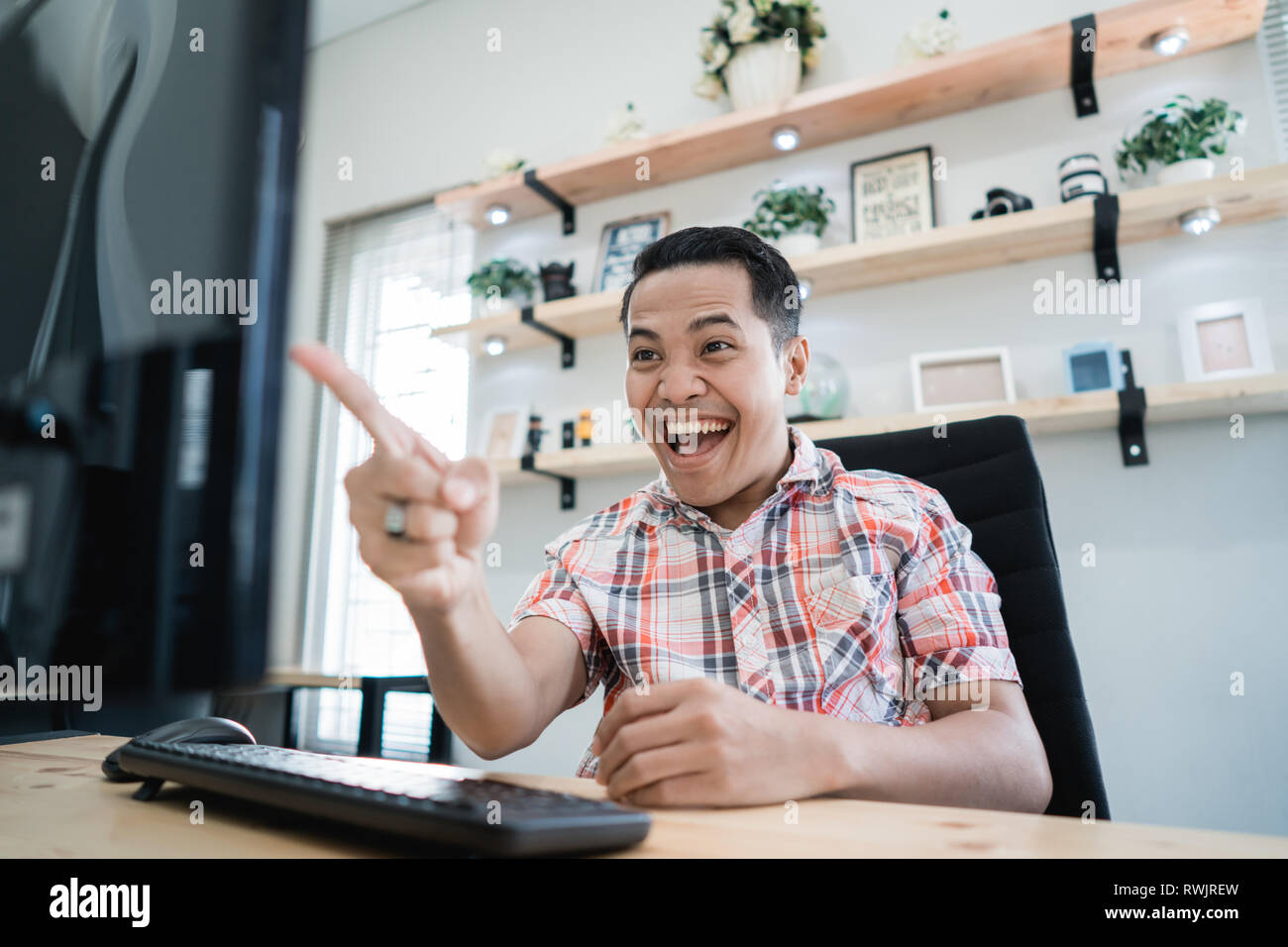excited man happy about winning Stock Photo - Alamy