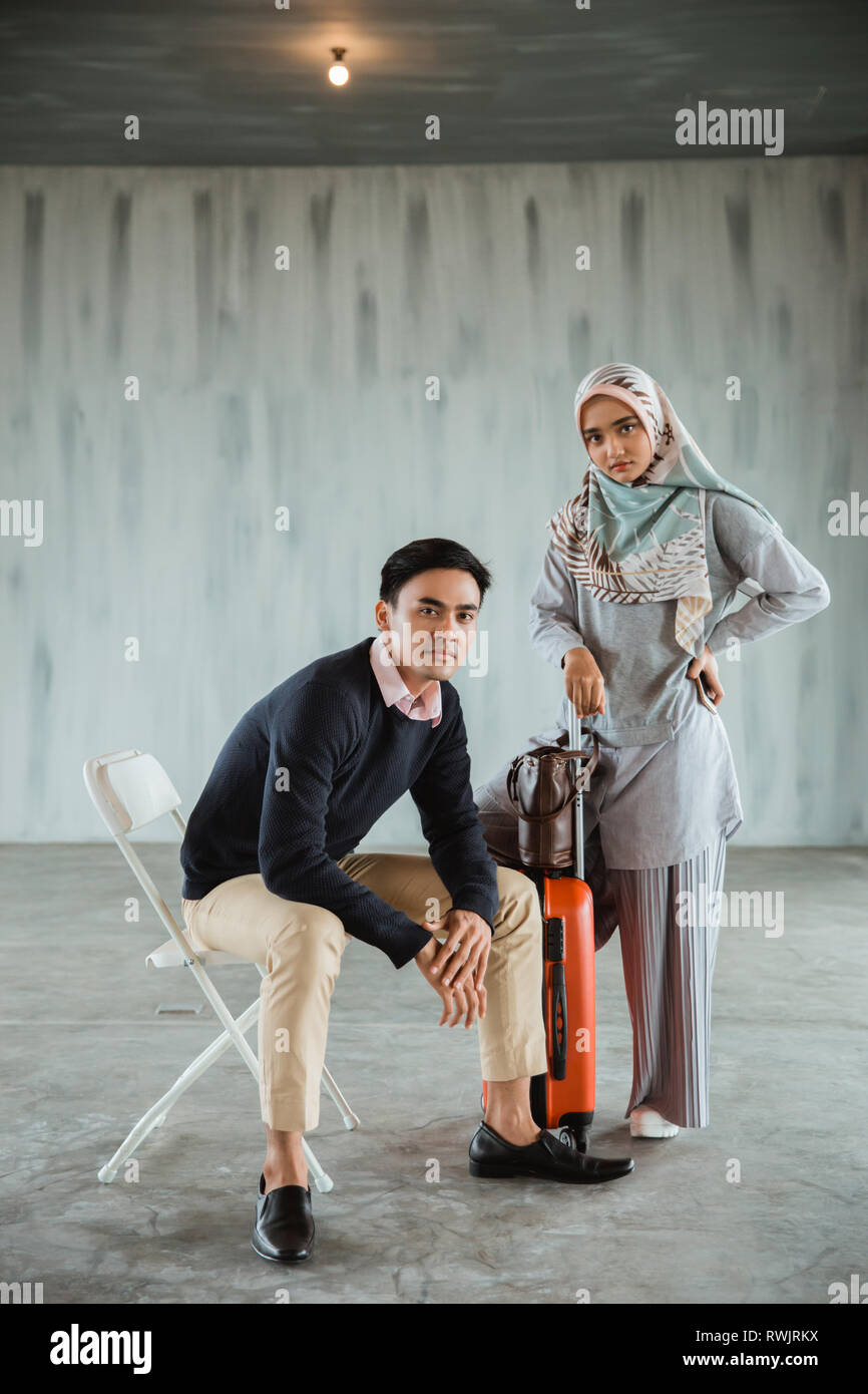 two confident pose model in the building hall Stock Photo - Alamy