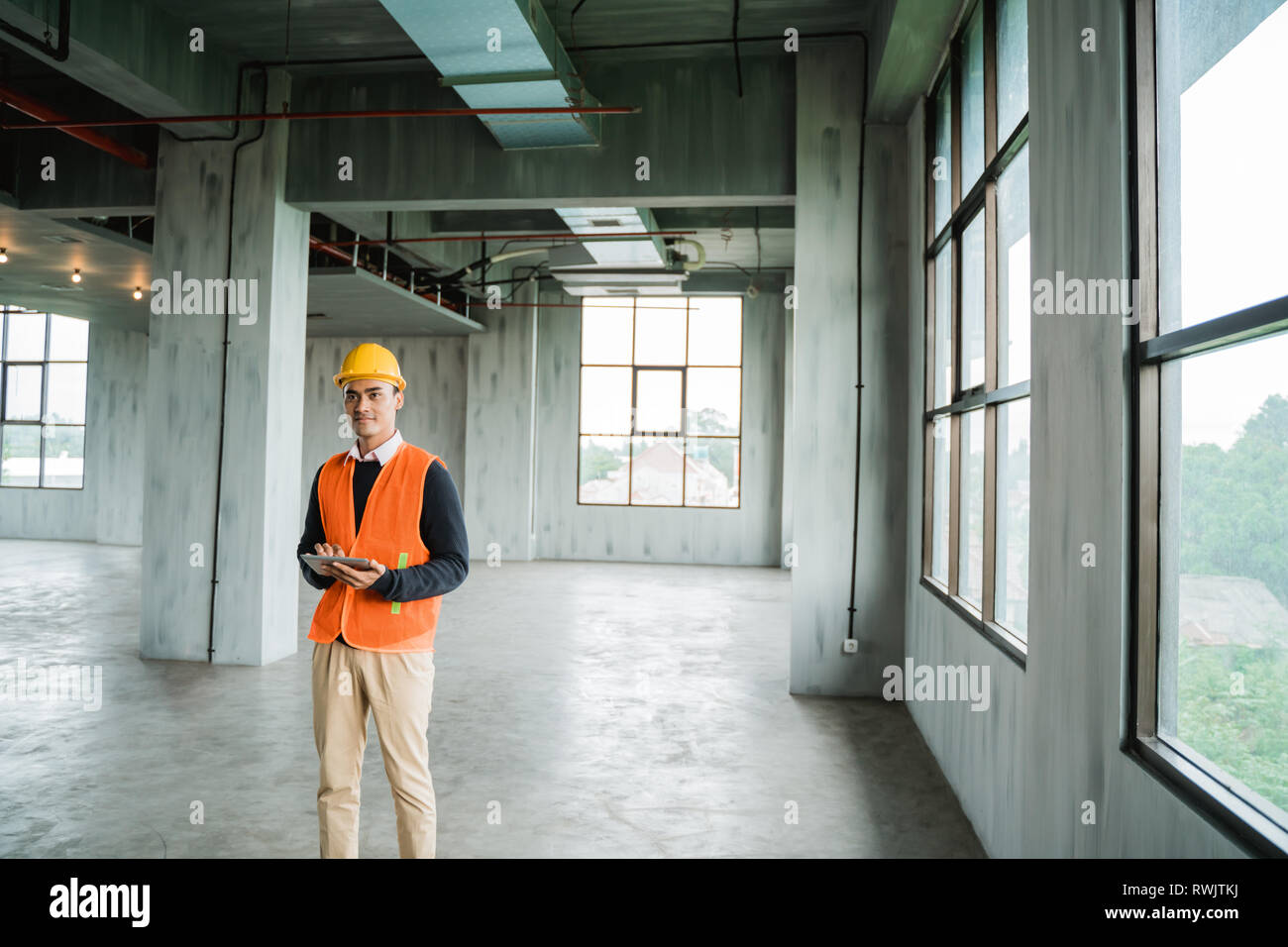 Professional engineers inspecting house hi-res stock photography and ...