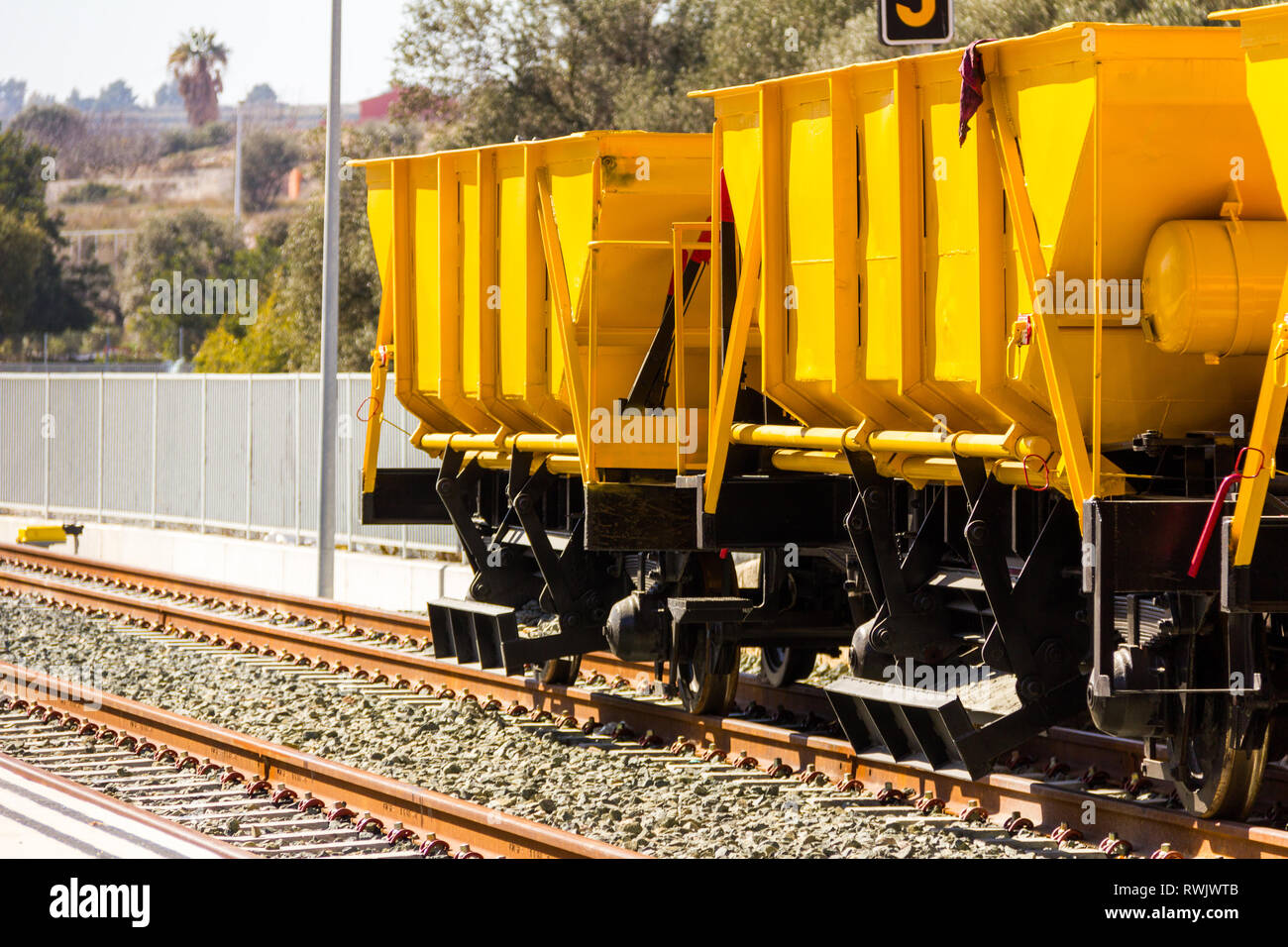 Ballast train. A large cargo yellow train at the station Stock Photo - Alamy