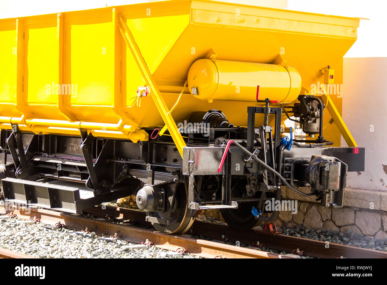 Ballast train. A large cargo yellow train at the station Stock Photo ...