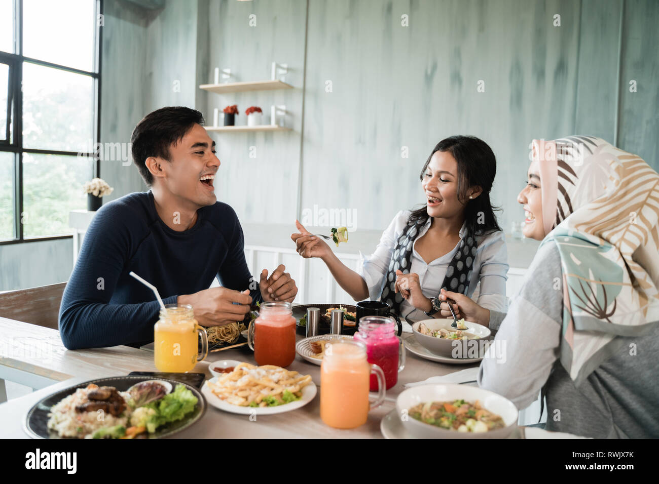happy asian friends having lunch together Stock Photo - Alamy