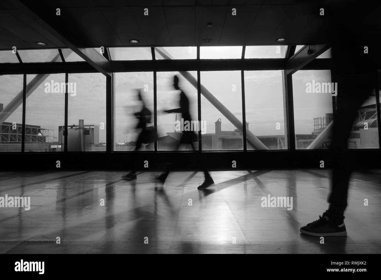 Airport rush - a few people rushing through an airport terminal Stock ...