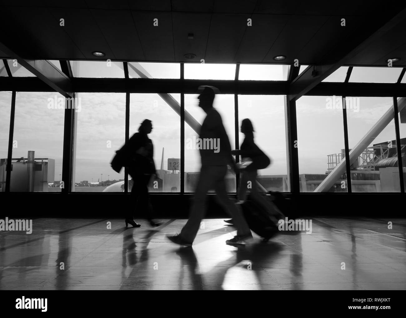 Airport rush - several people rushing through an airport terminal Stock ...