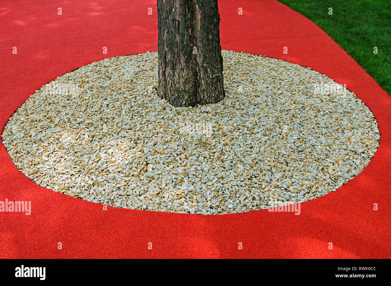 Crushed stone surrounding the trunk of a tree. Element of landscape ...