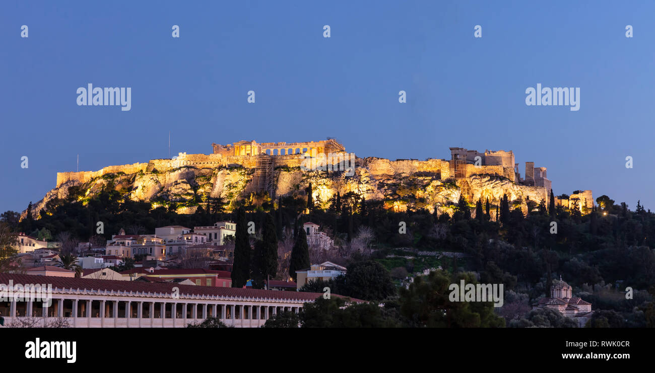 Acropolis of Athens Greece rock and Parthenon illuminated, blue sky ...