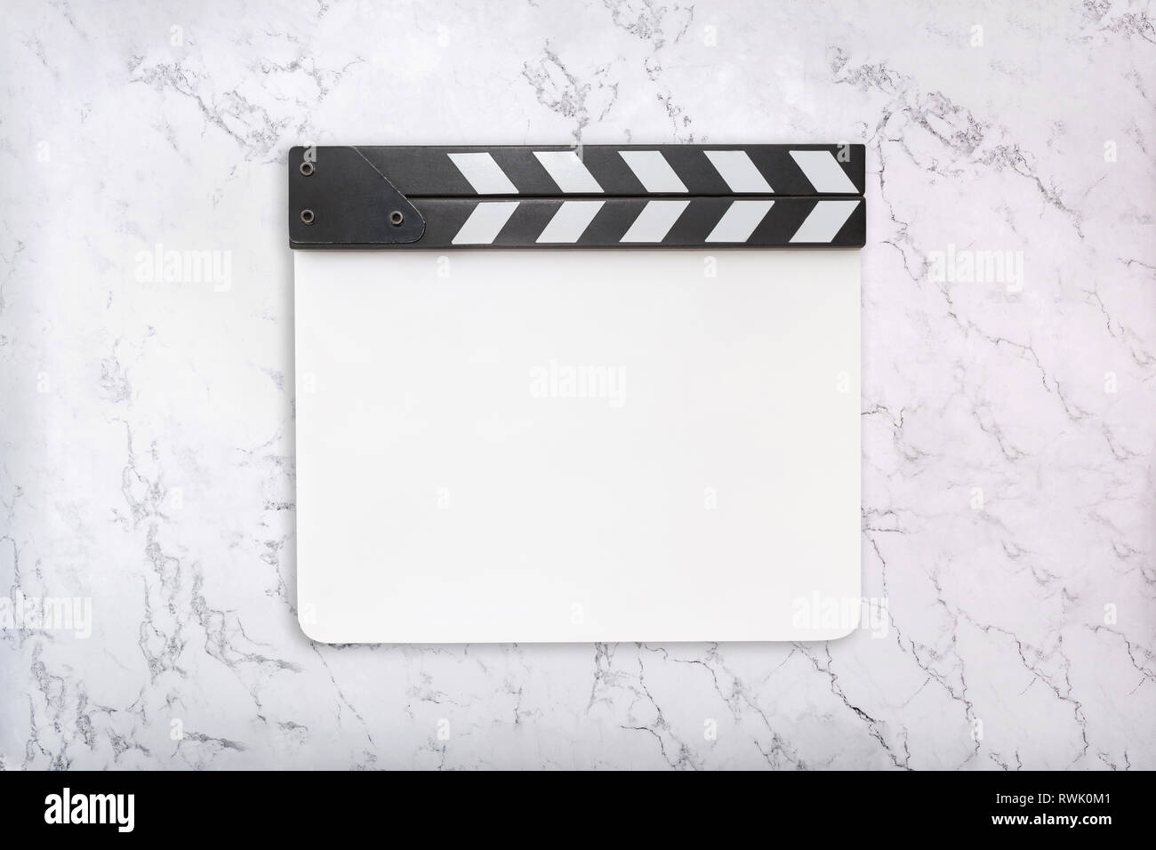 White clapboard on white marble background. Clapper board template ...