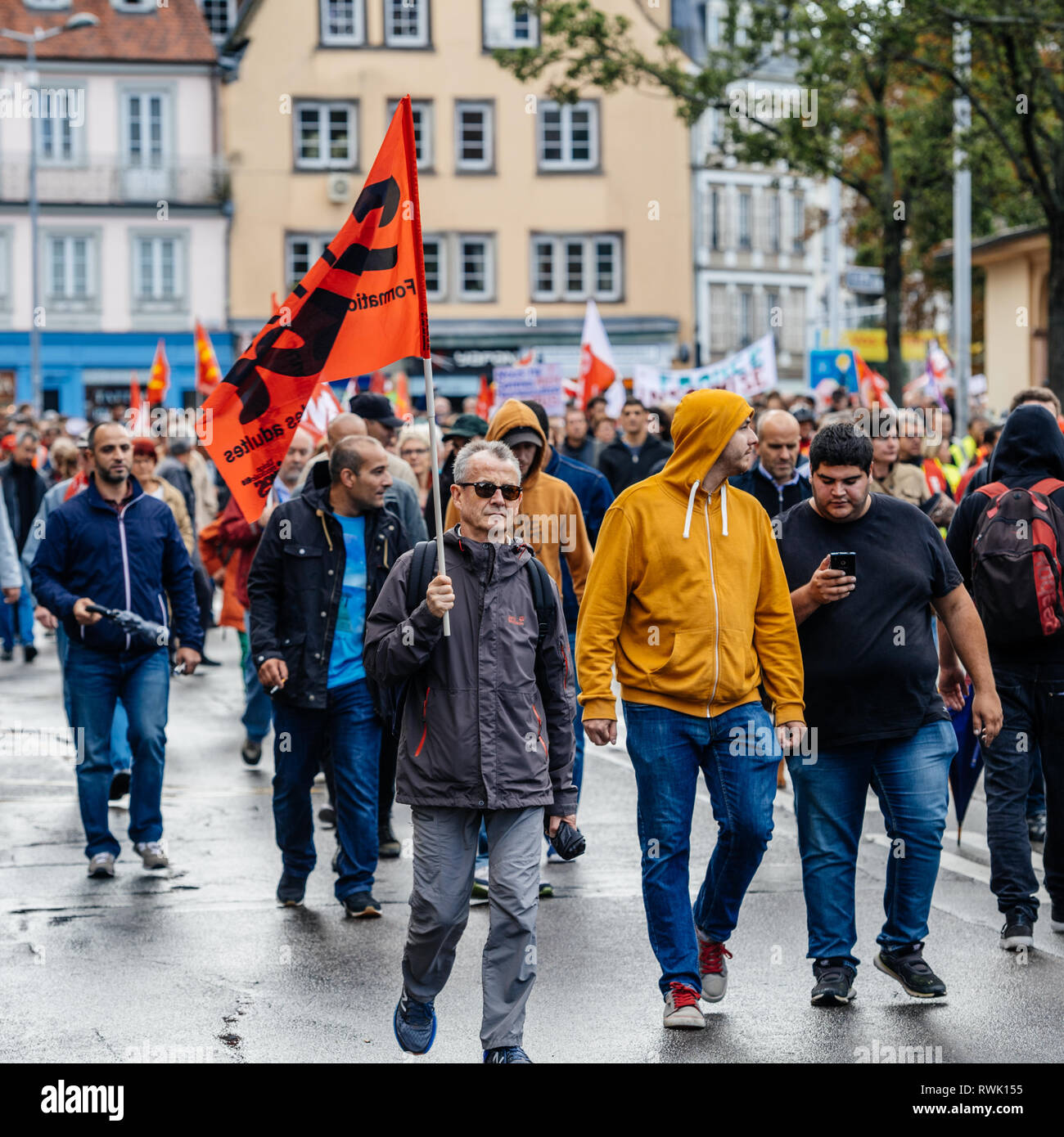Strasbourg, France - Sep 12, 2017: Man with red flag at political march ...