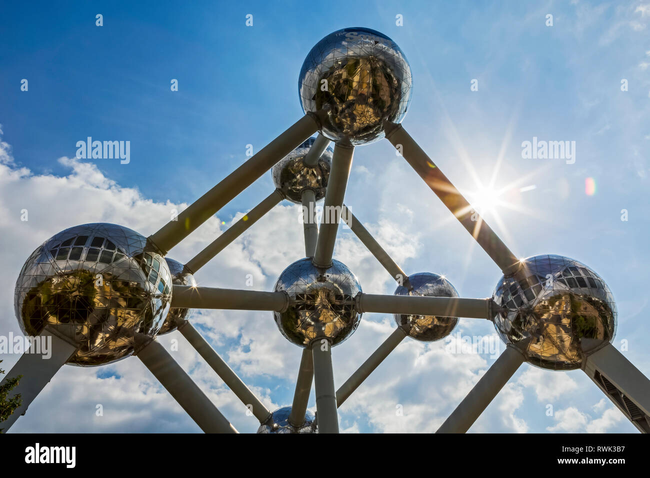 Large stainless steel art structure in the shape of an atom with blue ...